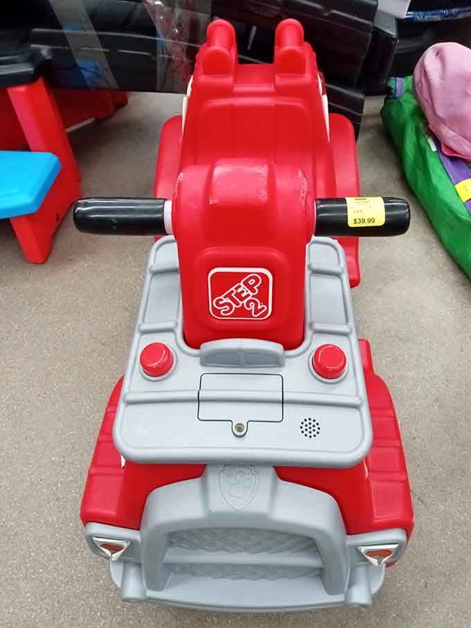 This bright red ride-on toy will make some lucky kid the happiest person on the block.