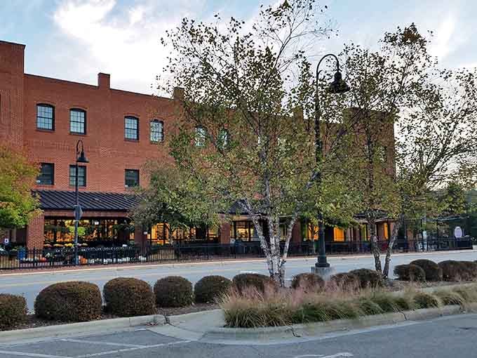 The warm glow from those windows promises the kind of welcome that makes strangers feel like regulars instantly.