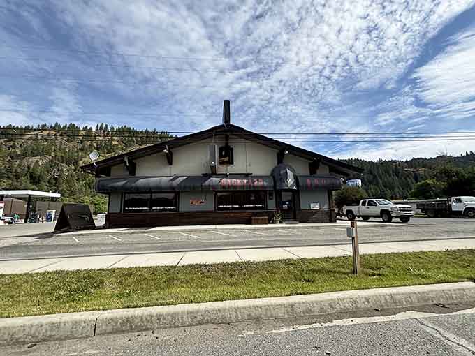 Alpine-style architecture nestled against forested slopes where the air smells like pine trees and possibility every single morning.