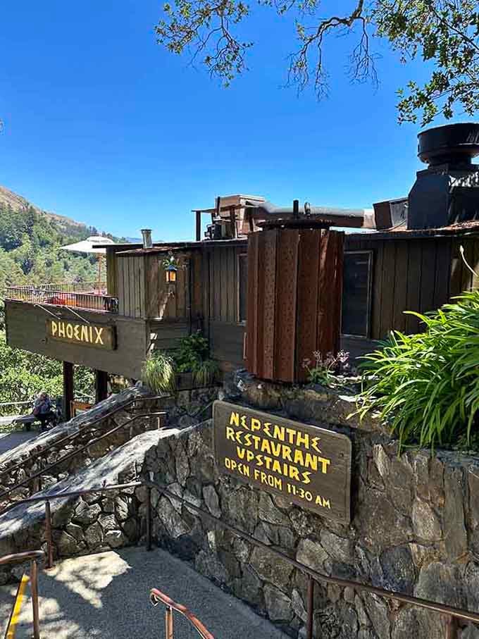 Rustic wooden structures cling to the clifftop like they've grown naturally from the Big Sur mountainside itself.