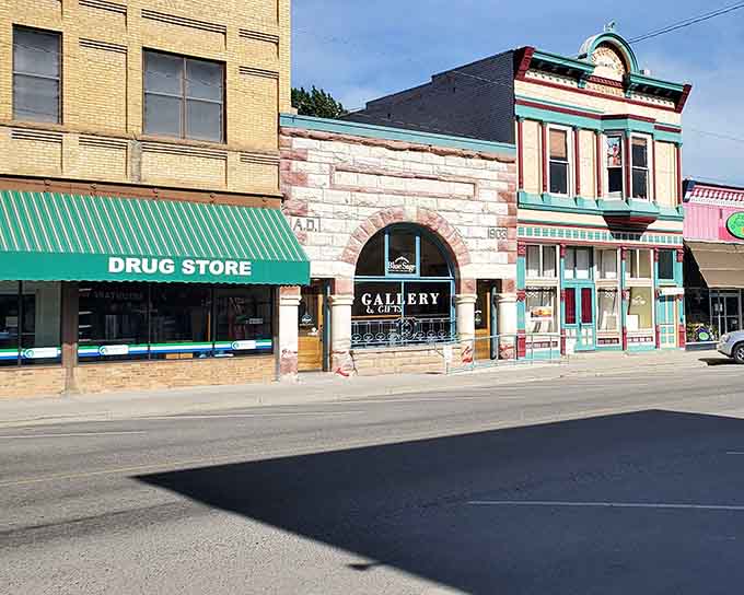 The old drug store still serves the community beside galleries where Western heritage meets contemporary mountain culture.
