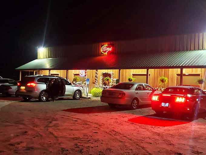 That glowing red neon sign cutting through the night is like a beacon calling all steak lovers home.