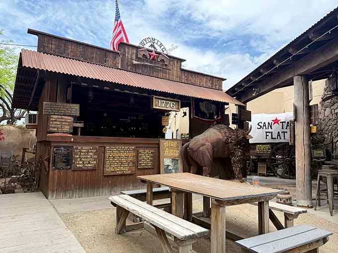 The rustic saloon entrance with its vintage charm promises an evening of frontier fun and seriously good grub.