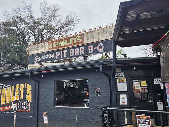 The weathered vintage sign towers above the street like a beacon, calling barbecue lovers from blocks away.
