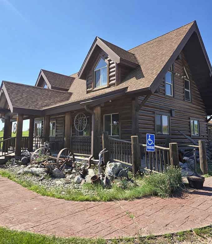 The authentic log construction and wagon wheel details create a frontier atmosphere where hearty appetites meet even heartier portions.