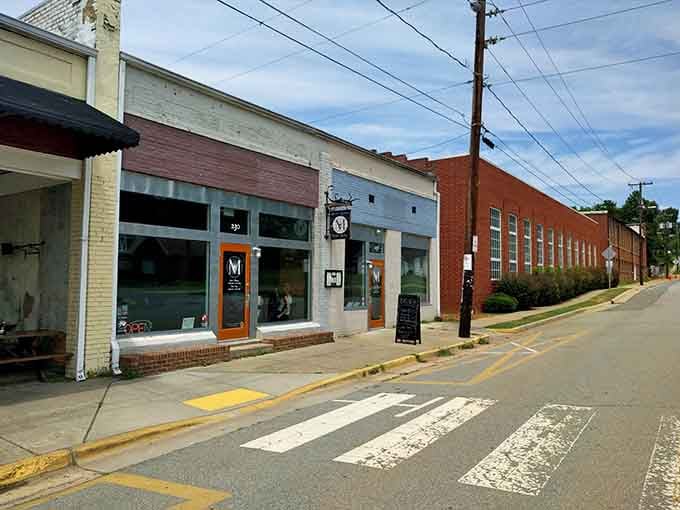 Notice those crosswalks? They're practically begging you to slow down and discover what makes this street special.