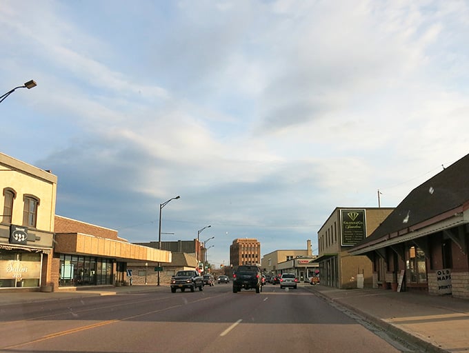 Golden hour transforms ordinary storefronts into something magical, like a Norman Rockwell painting come to life.