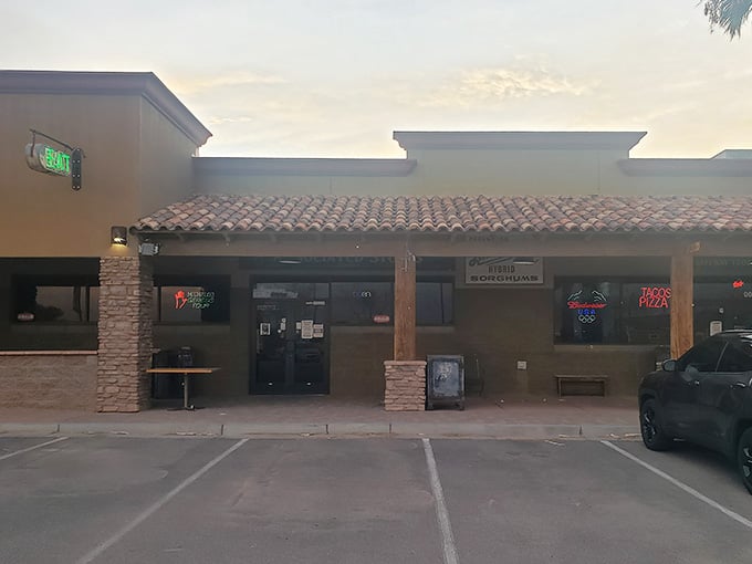 Evening shadows stretch across the parking lot of this neighborhood gathering place for motorsports enthusiasts everywhere.