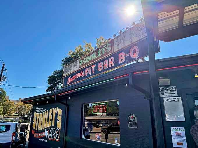 That glowing "OPEN" sign at dusk is like a lighthouse for hungry souls seeking refuge in perfectly smoked brisket.