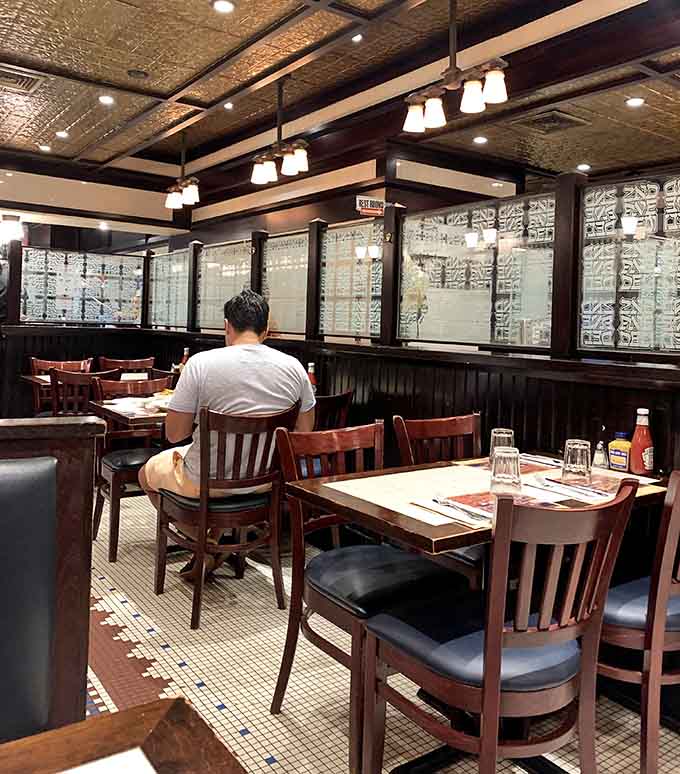 Classic booth seating invites you to settle in, get comfortable, and prepare for serious eating ahead.