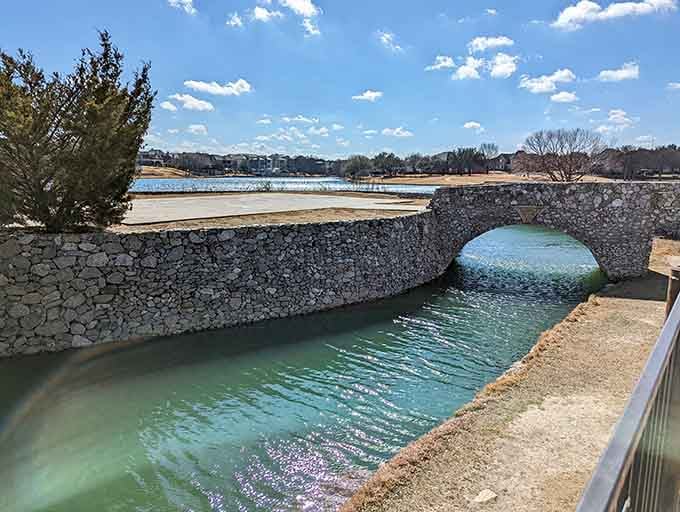 This stone arch bridge spans the water with Old World craftsmanship that photographs beautifully year-round.