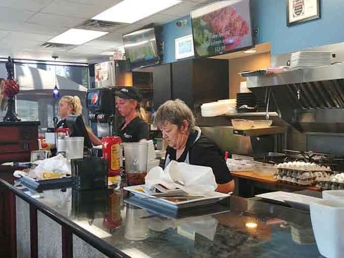 The counter area where orders come together and staff keep everything running smooth as butter on a hot griddle all day.