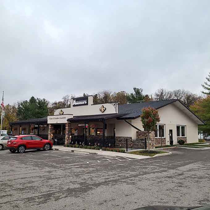 Charming exterior with fleur-de-lis details and outdoor seating, inviting you to experience Southern hospitality done absolutely right every time.