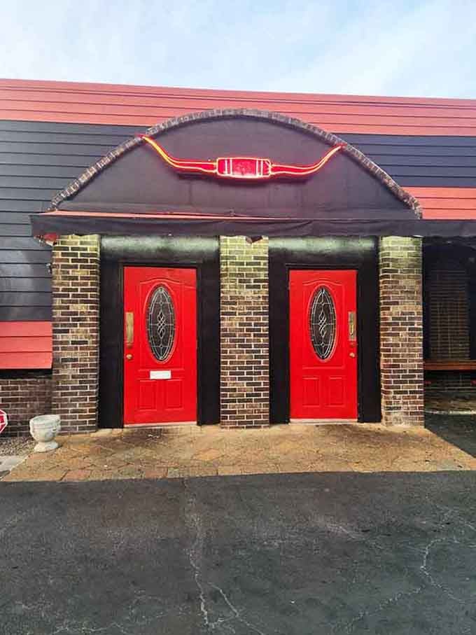 Bold red entrance doors that welcome you into steak paradise, no secret password required for entry.