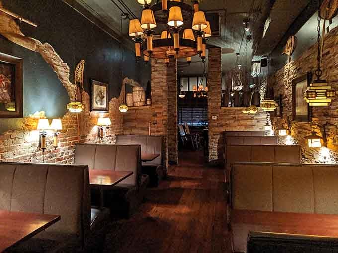 Booth seating with exposed brick and rustic wood &ndash; comfortable enough to settle in for the long haul.