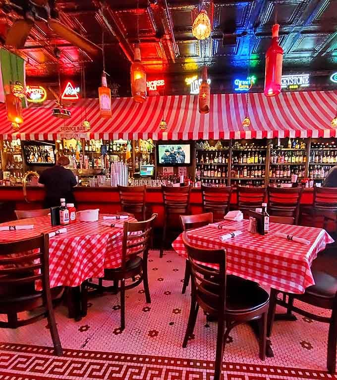 The glowing neon signs and polished bar create an inviting space where strangers become friends over cold beers.