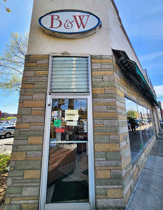 The entrance welcomes you with that classic B&W sign, promising the kind of old-school quality that never goes out of style.