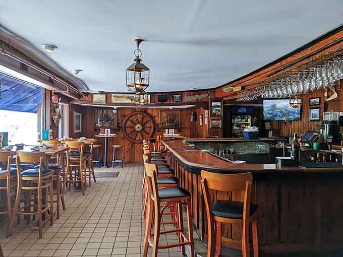 The curved bar with its wooden stools invites you to settle in for the long haul with a cold drink and conversation.