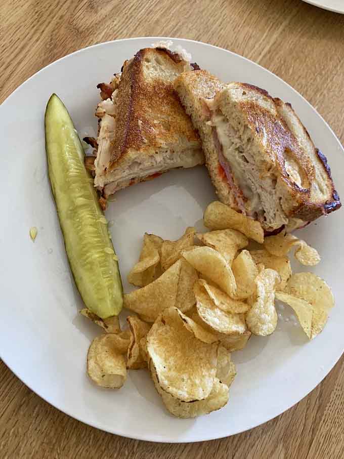 A grilled sandwich cut to reveal its glorious interior, because presentation matters even with comfort food.