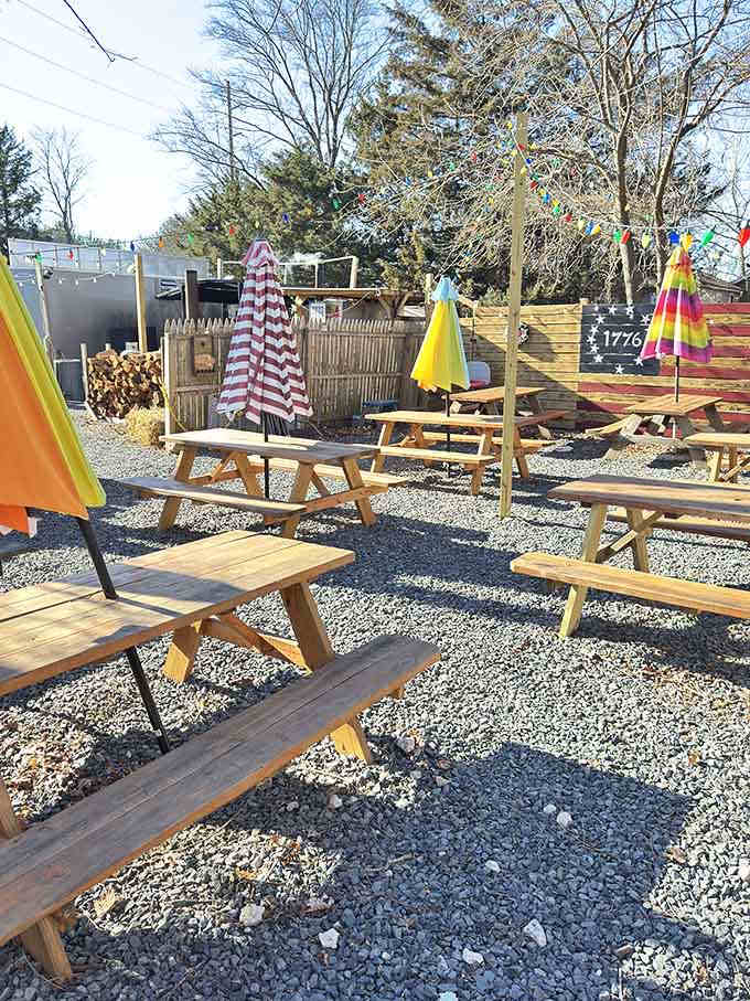 Colorful umbrellas and picnic tables create the perfect setting for serious barbecue consumption time.