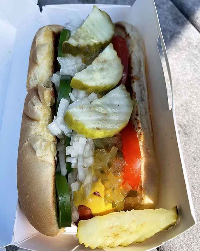 Chicago-style done right: sport peppers, pickles, onions, and all the fixings that make the Windy City proud, even here.