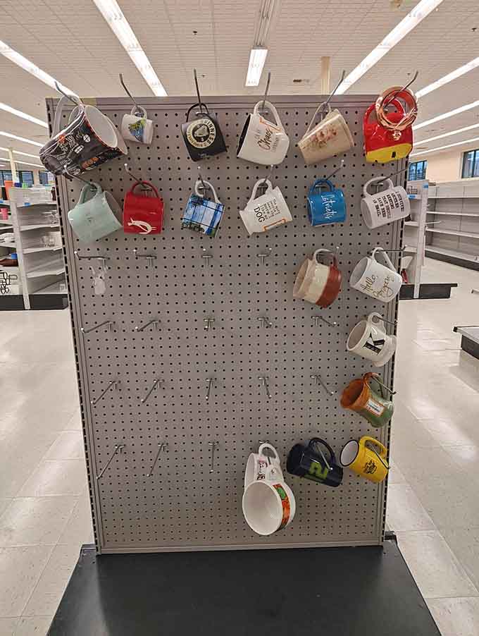 Coffee mugs hanging like a caffeinated art installation, each one with its own personality and story.