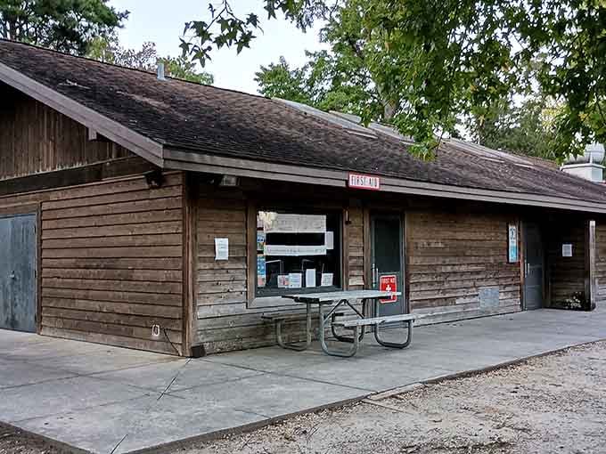 A rustic wooden shelter stands ready to patch up park adventurers&mdash;because even the best days outdoors occasionally need a Band-Aid.