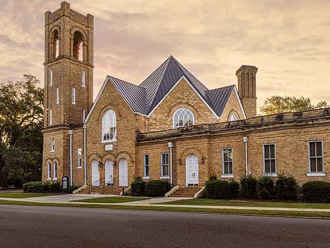 This Gothic Revival church's brick towers reach skyward like they're trying to touch the clouds themselves.