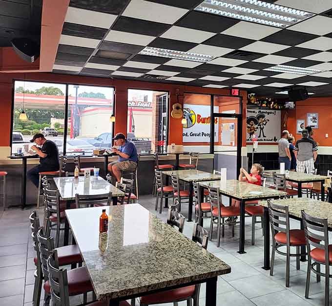 Real people enjoying real food in a real restaurant, which is refreshingly normal in our filtered world today.
