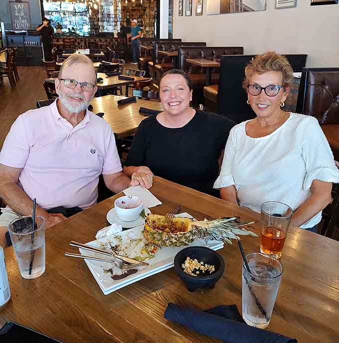 Three happy diners enjoying their meal together—this is what good food and great atmosphere look like in action.