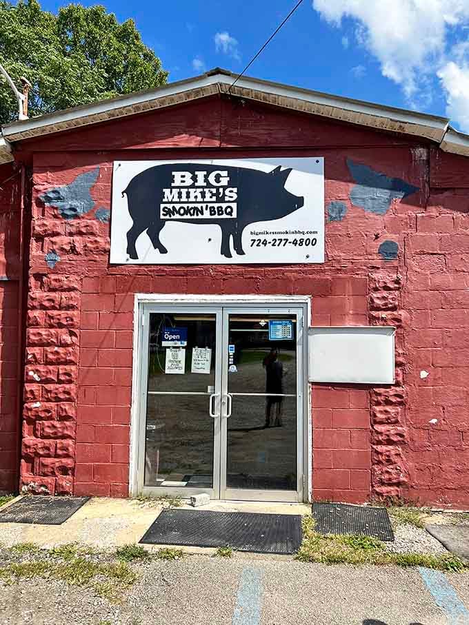 The red brick exterior and straightforward signage announce honest barbecue without pretense, just like your favorite neighborhood joint should.
