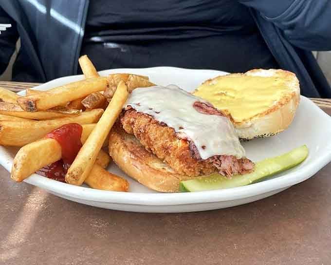 Chicken cordon bleu with fries and pickle spear, because sometimes you need breaded poultry wrapped around ham.