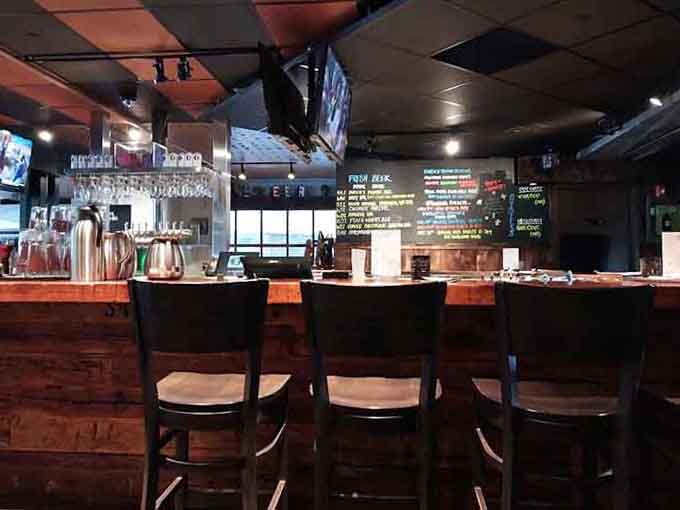 The bar area beckons with its polished wood, multiple screens, and that all-important beer list glowing above.