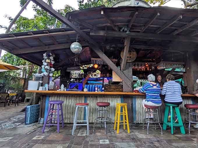 Colorful bar stools around a rustic counter where mimosas flow and judgments about day drinking mysteriously disappear.