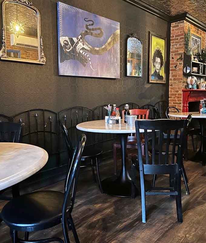 Mismatched furniture and quirky wall art create an atmosphere where everyone feels welcome and nobody takes themselves too seriously.