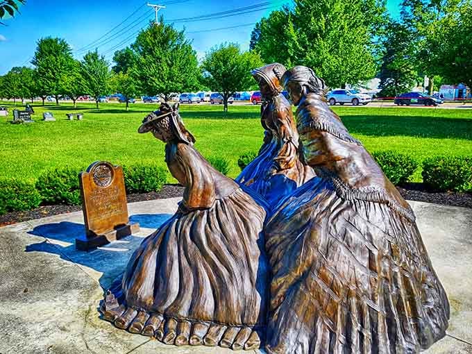 Bronze figures commemorate the women whose simple act of remembrance sparked a nationwide tradition of honor.