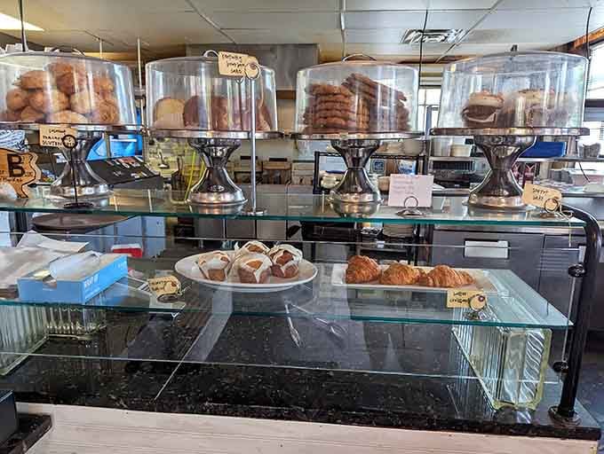Those glass cake stands holding treasures that'll test your willpower before you've even ordered your main course.