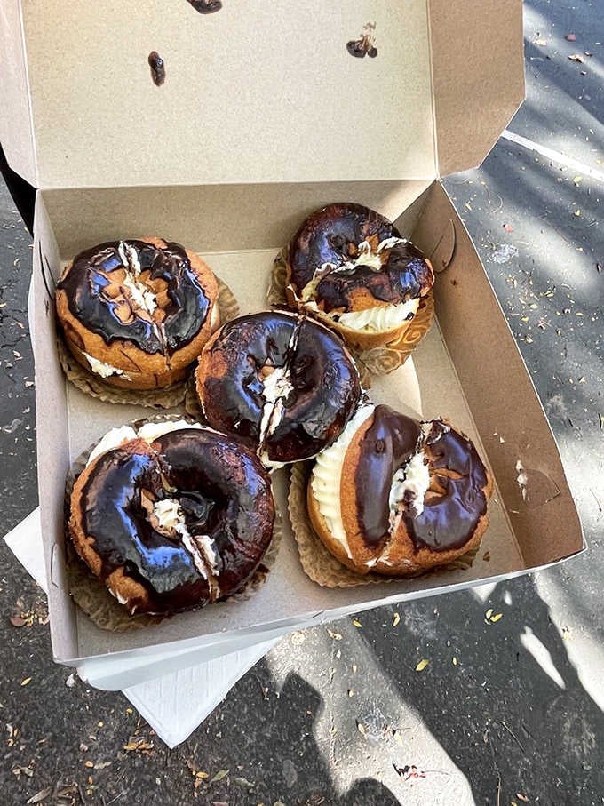 Boston cream donuts that would make the Kennedys jealous, glistening with chocolate like they own the place.