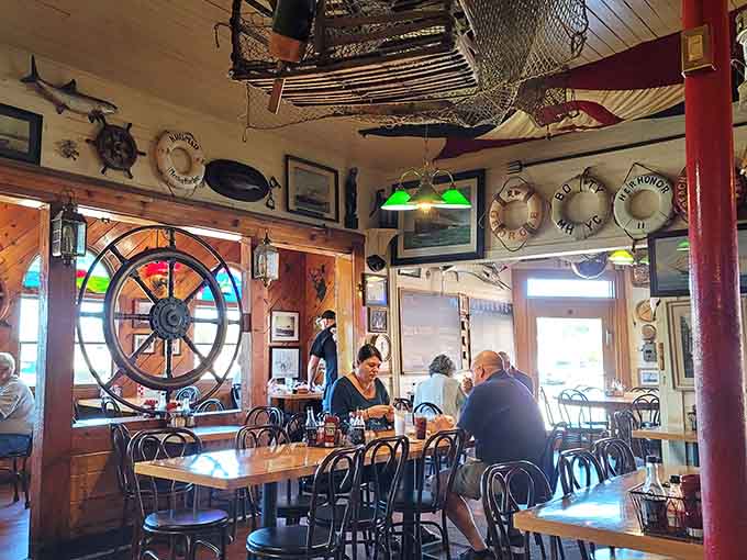 That ship's wheel on the wall has probably witnessed more dinner conversations than a therapist's couch.