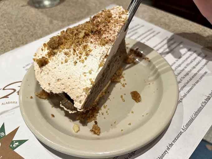 Dessert arrives as the sweet finale your meal deserves, towering with enough cream to require structural engineering.