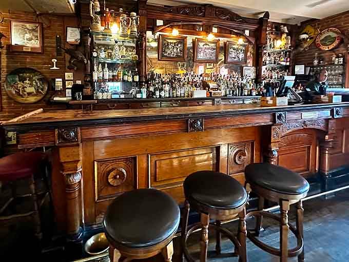 The ornate wooden bar has witnessed more stories, deals, and celebrations than most buildings see in ten lifetimes combined.