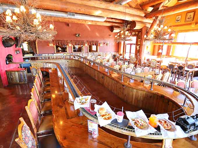 That curved train track loaded with meals creates a dining experience that's part restaurant, part entertainment spectacle.