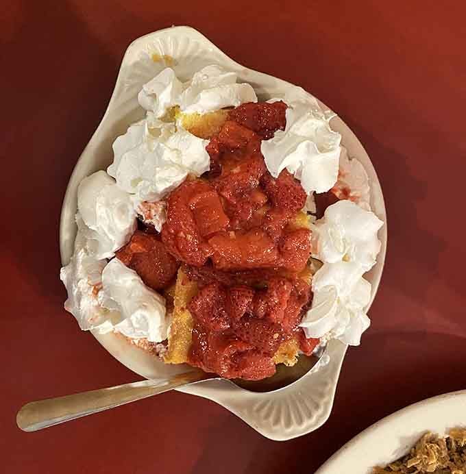 Strawberry shortcake topped with whipped cream, because you've earned dessert after all that delicious damage.