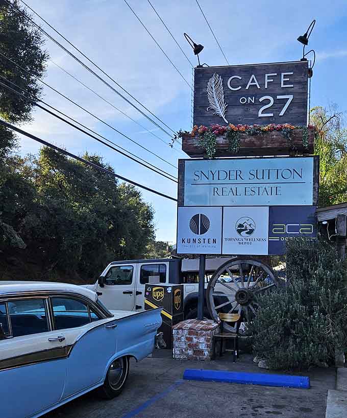 The sign sits above the canyon road like a beacon for hungry travelers who know good food when they find it.