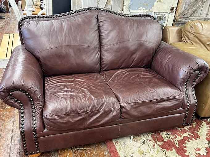 Leather furniture with the kind of patina that new stuff tries desperately to fake.
