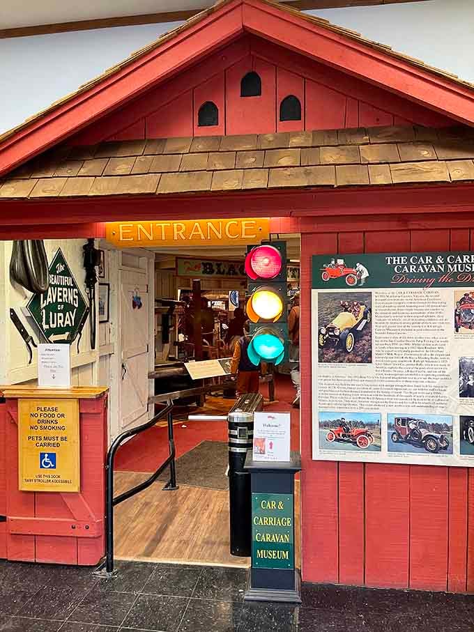 That charming red entrance with its vintage traffic light welcomes you into a world where horsepower meant something different.