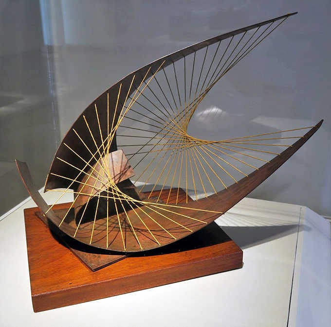 Curved wood and delicate strings create mathematical elegance, proving geometry can be absolutely gorgeous when done right.