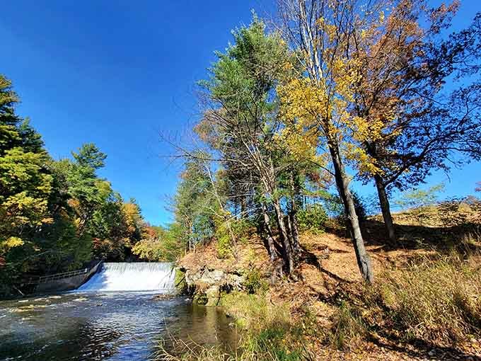 Glen Loch Dam cascades through autumn colors, proving that infrastructure can be both functional and absolutely gorgeous to photograph.