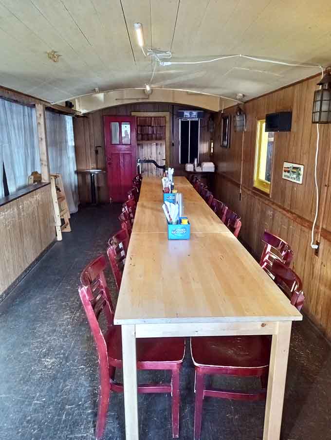 Inside the caboose, a long communal table turns dinner into an adventure for families and groups alike.