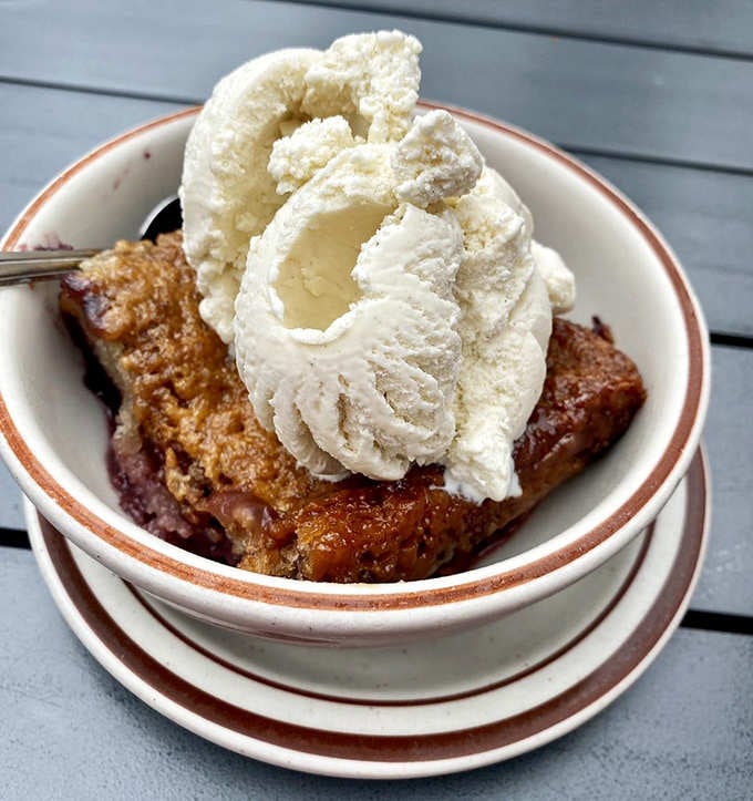 Marionberry cobbler topped with whipped cream is Oregon's answer to happiness in dessert form.